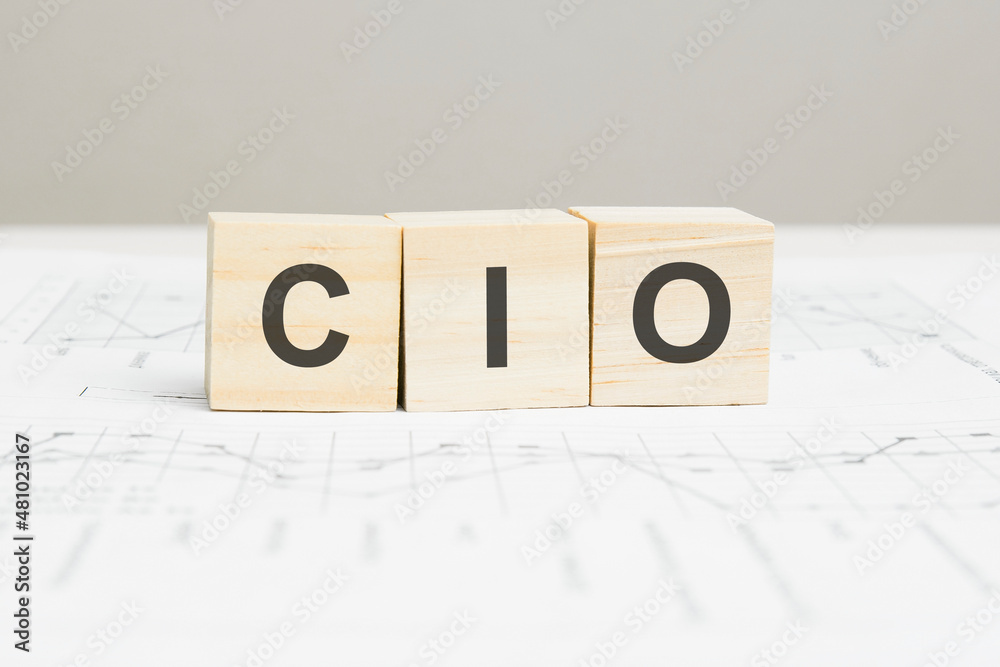 CIO wooden blocks word on grey background. CIO - Chief Information ...