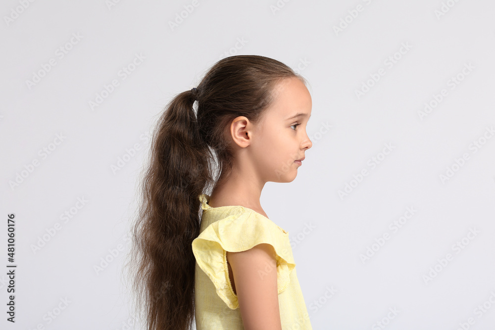 Cute little girl with ponytail on white background Stock Photo | Adobe ...