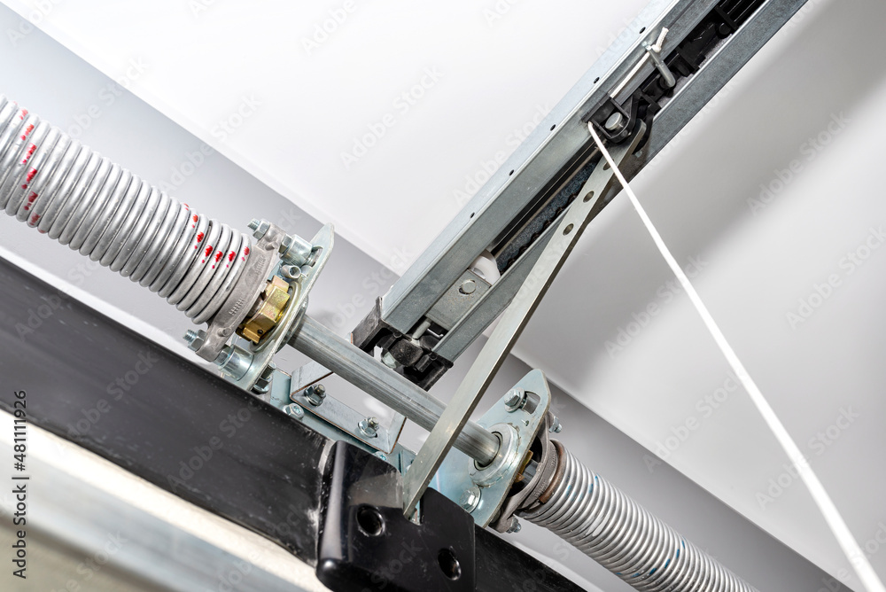 Springs tensioning the home garage door mechanism, visible ...