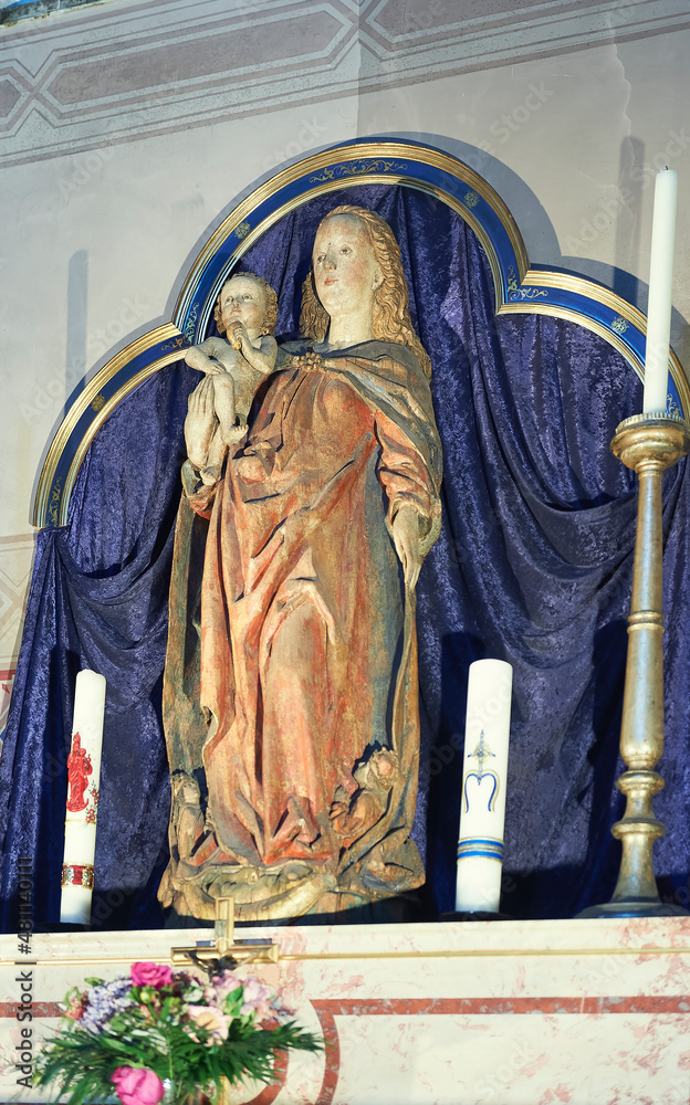 polychrome sculpture of the Virgin Mary with the child, crudely made ...