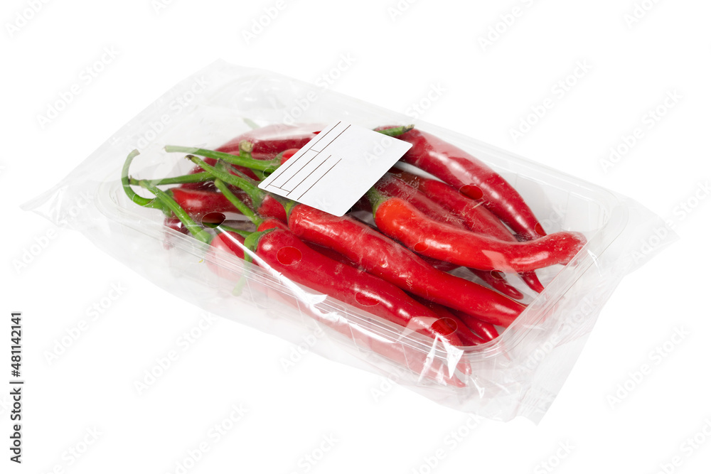 Packaged and labeled red chili peppers on an isolated white background ...