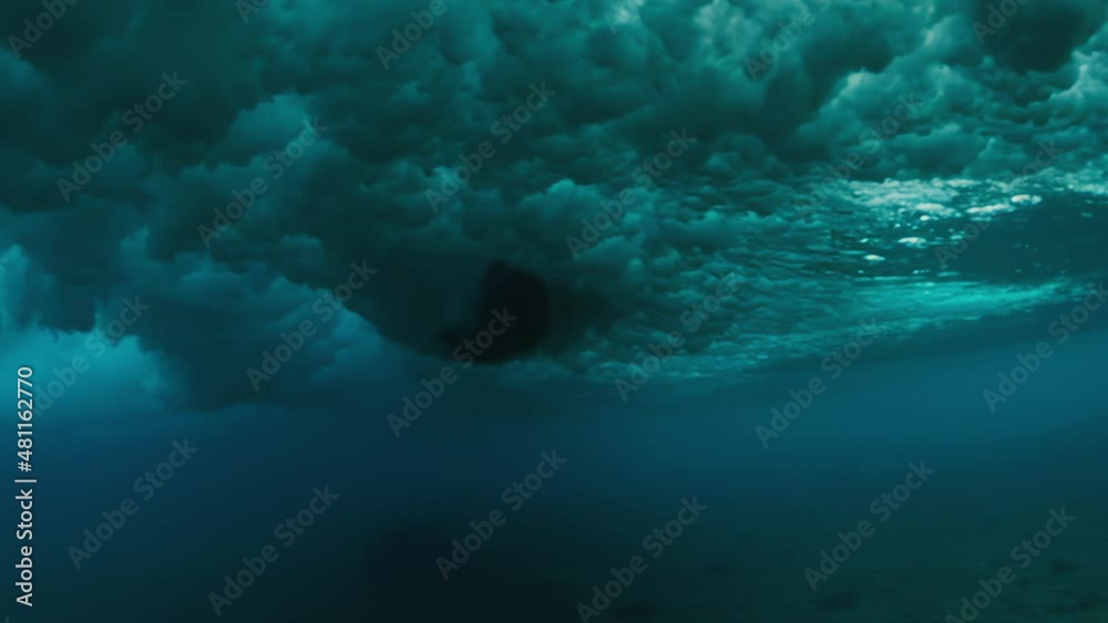 Man surfer falls into the water. Underwater view of the person falling ...