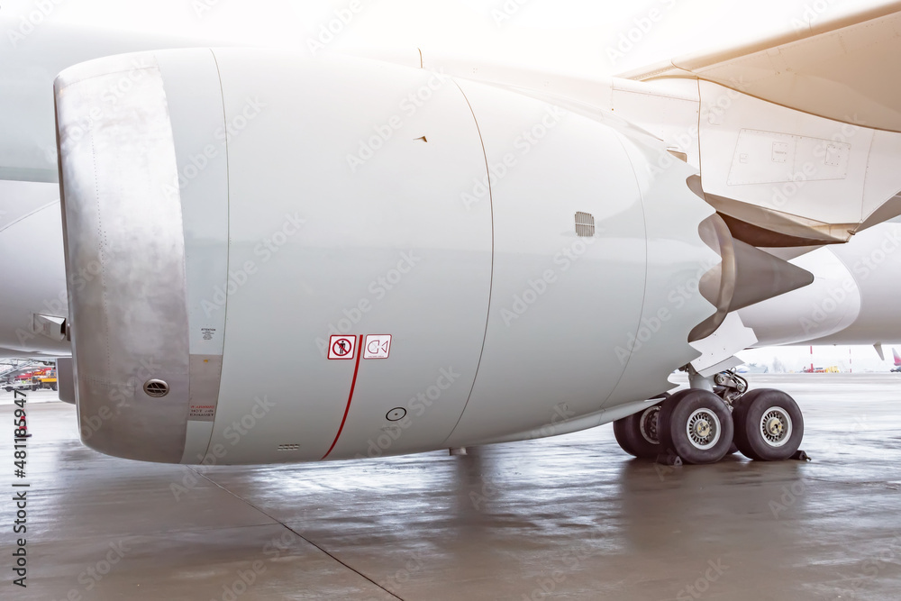 Huge passenger liner engine with landing gear, side view. Stock Photo ...