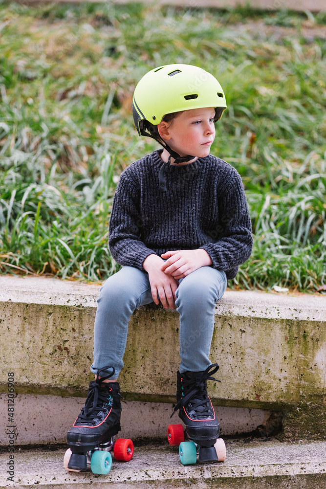 Boy in roller skates on street Stock Photo | Adobe Stock