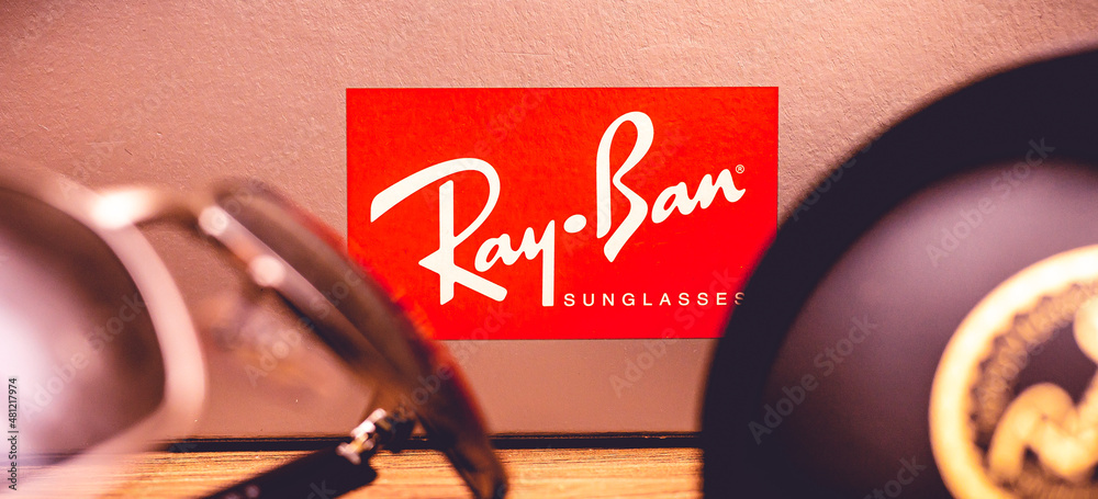 Ray-Ban company logo on a box with a defocused eyeglasses and eyewear ...
