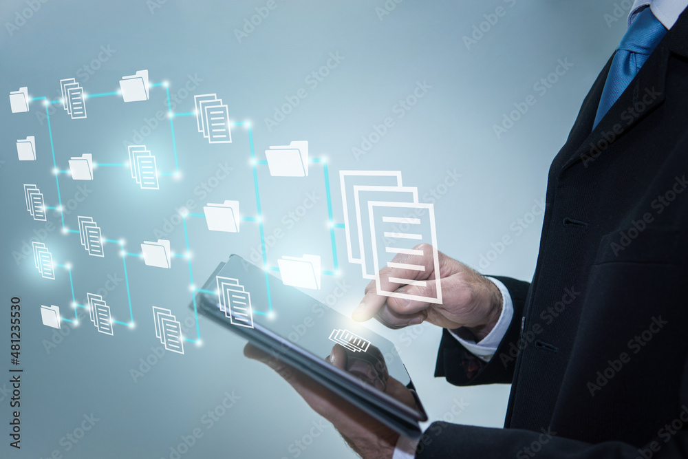 Businessman touching icons on digital tablet. Document Management ...