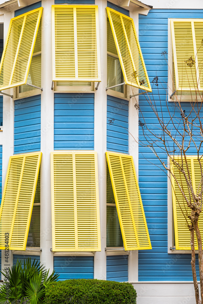 Seaside, Florida pastel blue and yellow painted colorful hurricane open ...