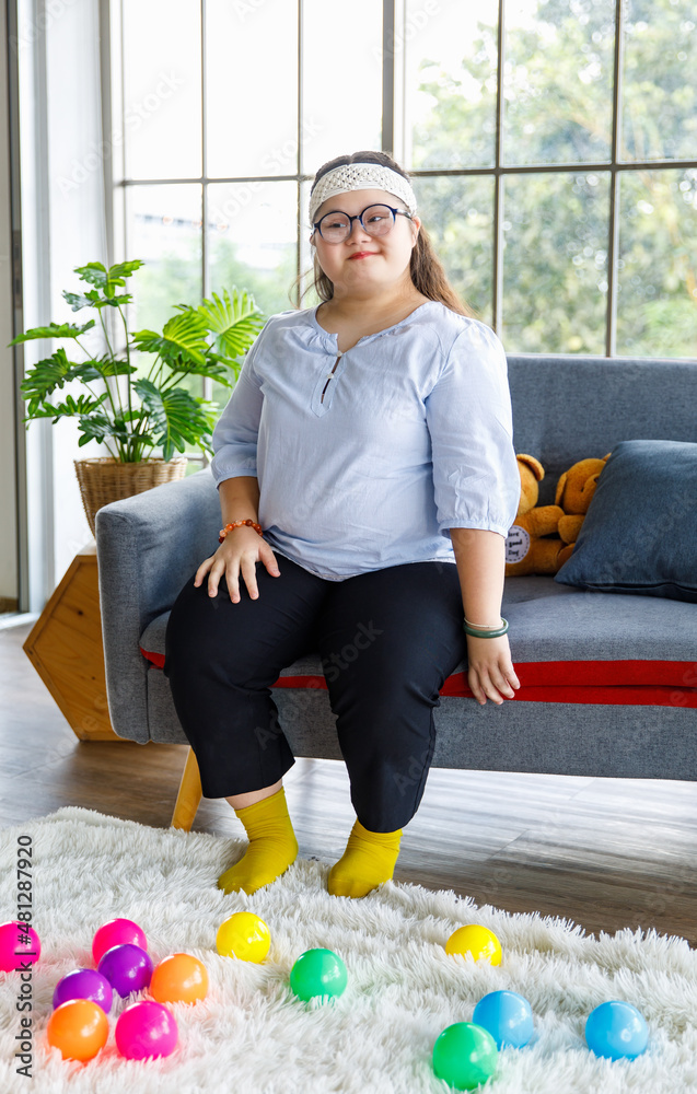 Portrait close up shot of Asian young happy chubby down syndrome ...
