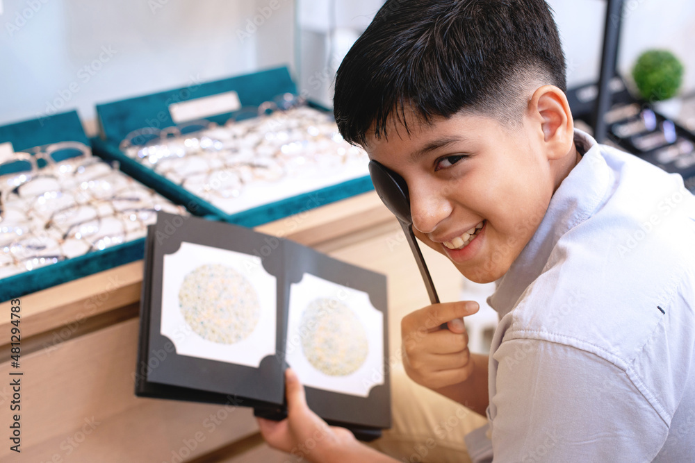 Indian child boy get color blindness tested with color blindness cards ...