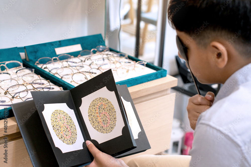 Indian child boy get color blindness tested with color blindness cards ...