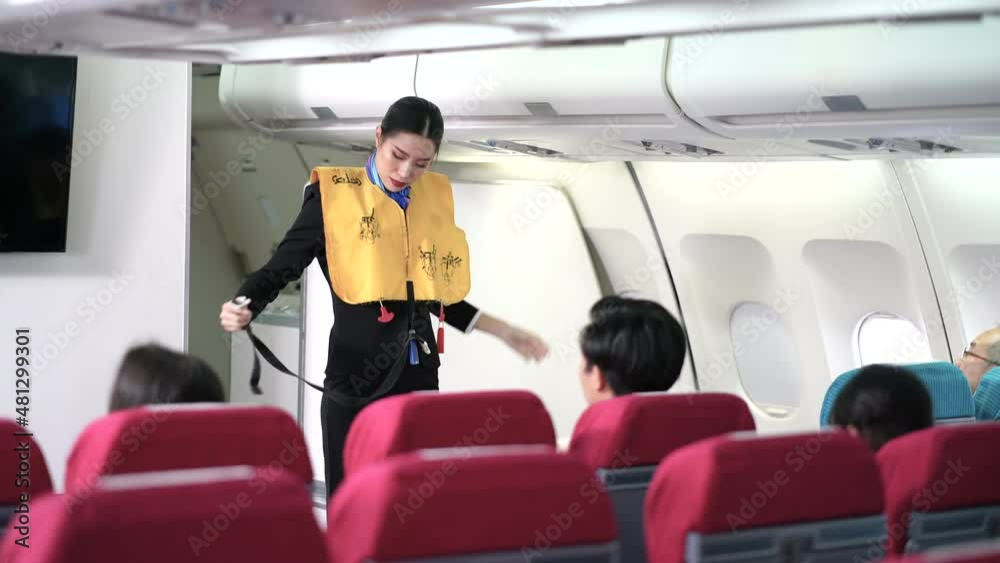 Video Stock Female flight attendant explaining and show safety ...