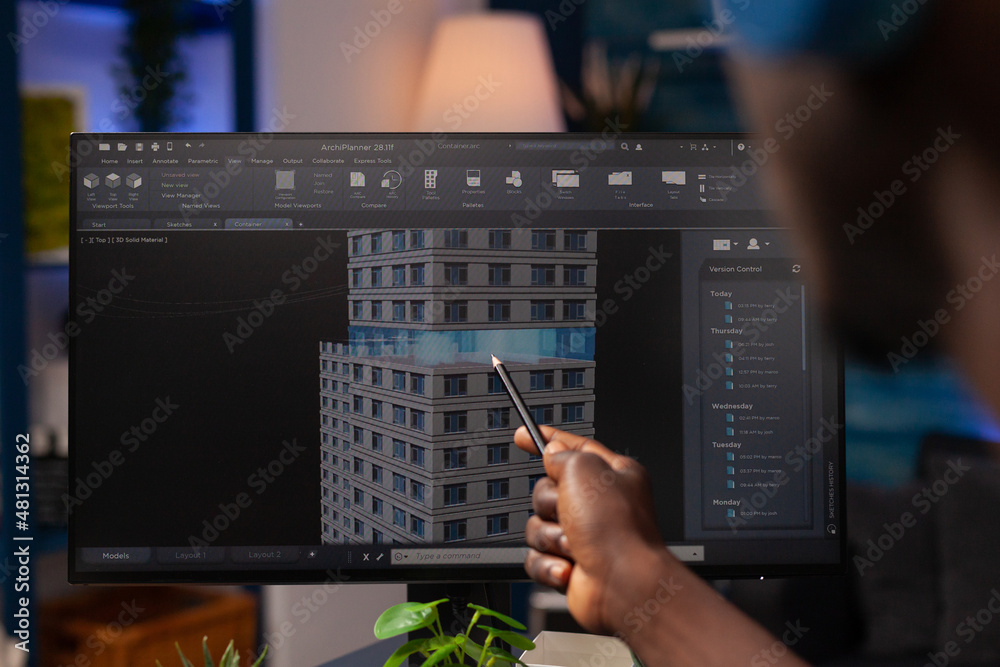 Architect engineer pointing at architectural building prototype ...