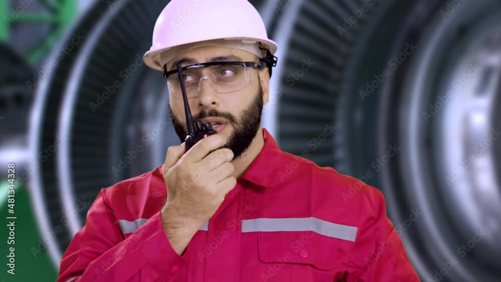 Close up young engineer wearing safety helmet and high visible vest ...