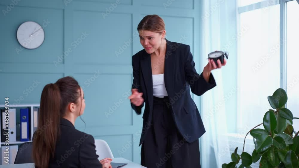 Boss screaming at frustrated employee, showing clock bullying and ...