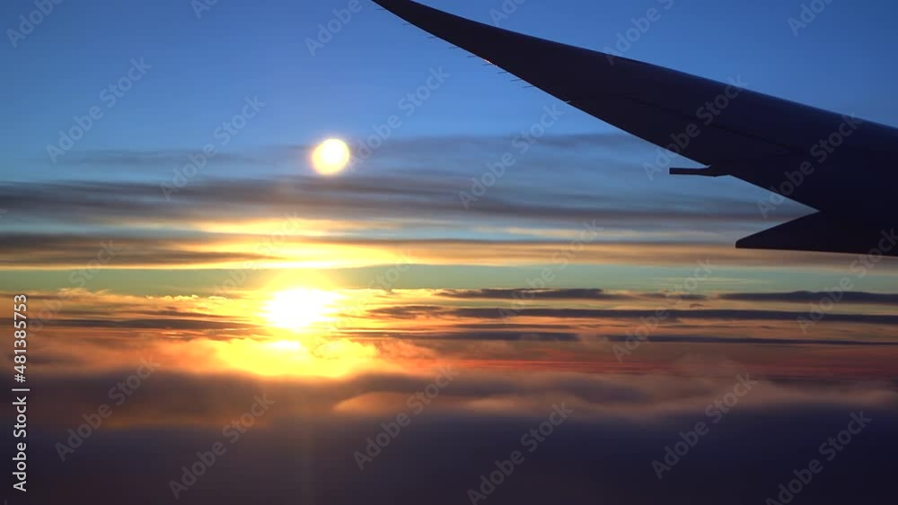 Airplane flight, start landing. Wing of an airplane flying close to the ...