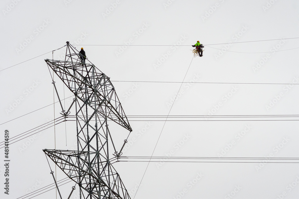 Installation and assembly of high-rise electrical towers. Stock Photo ...