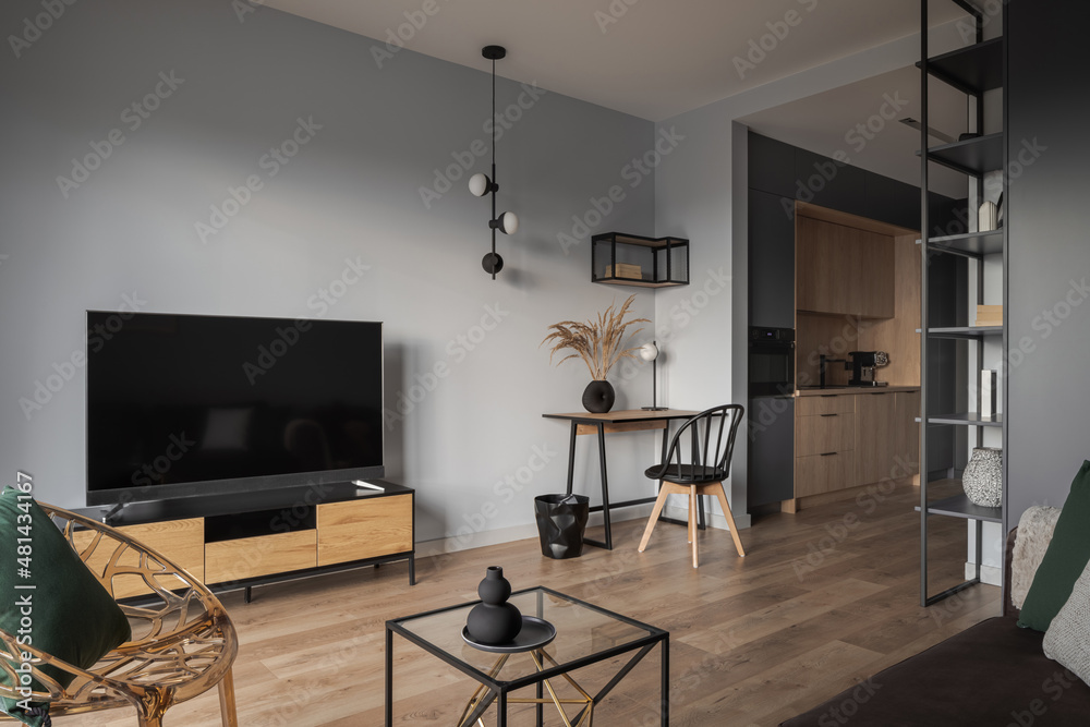 Open plan studio apartment with big tv Stock Photo | Adobe Stock