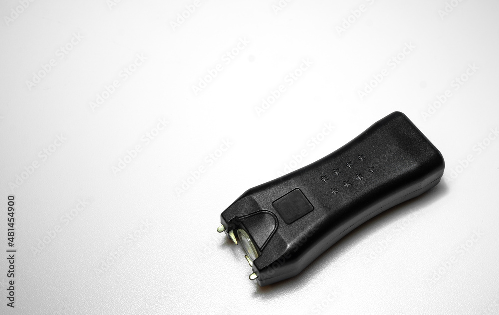 Compact stun gun in black on white isolate.A device for self-defense ...