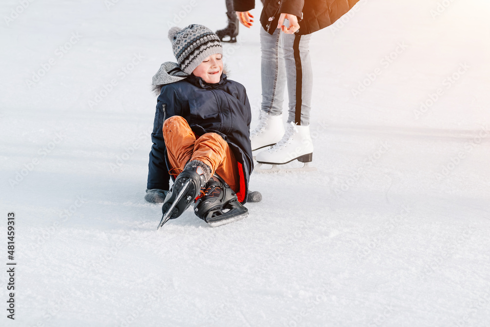Mom with baby boy ,learn train, ride winter city rink, ice skating.The ...