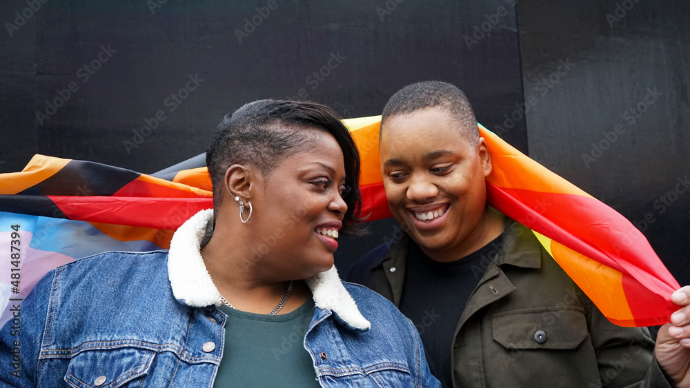 Two women with pride flag Stock Photo | Adobe Stock