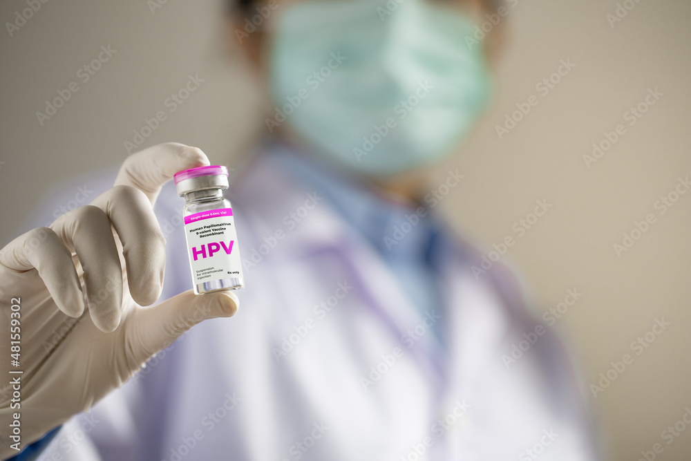 HPV (Human Papillomavirus) Doctor or scientist holding liquid vaccines ...