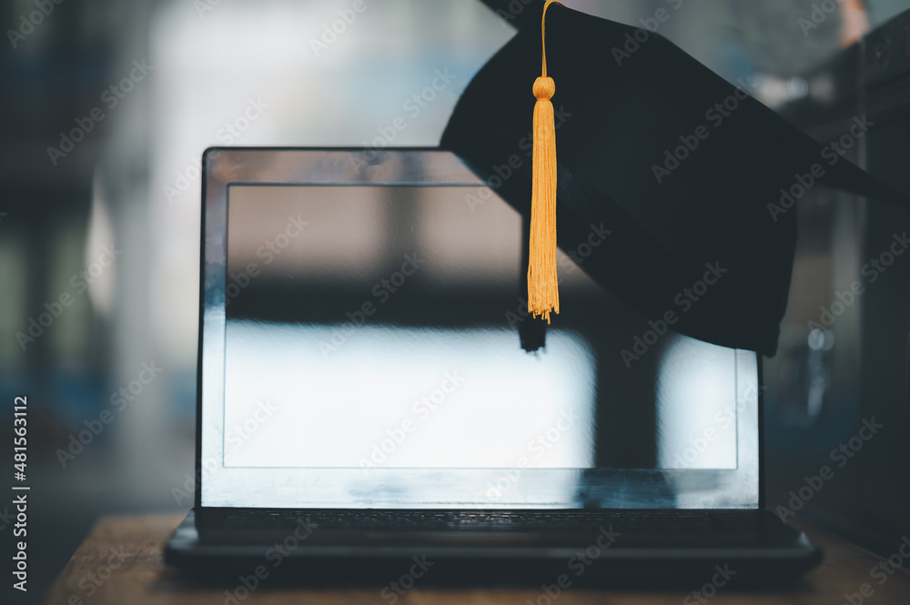 graduation cap put on laptop,concept of computer for education Stock ...