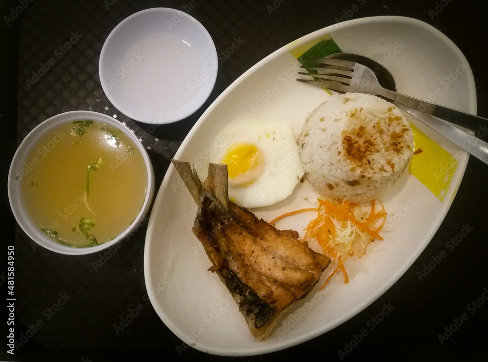 Typical Filipino breakfast of sinangag (fried rice), egg and marinated ...