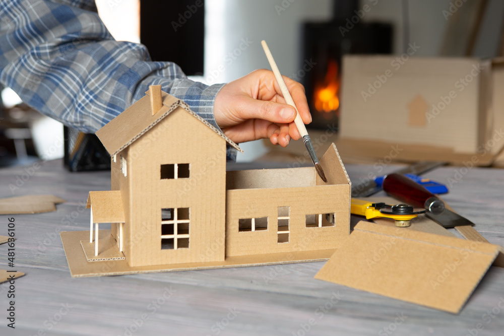 Workplace of architect - construction drawings, scale model and tools ...