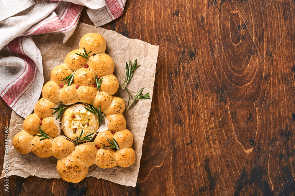 Bread buns Christmas tree with Roasted camembert cheese and rosemary on ...