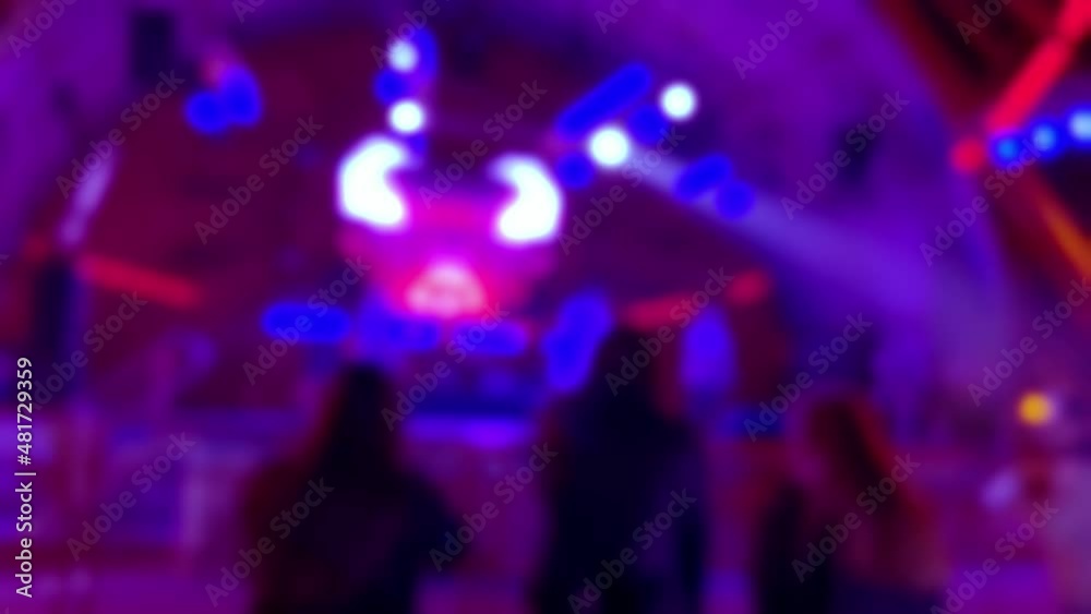 Dancing at disco with neon rays of light and hologram. Concept of ...