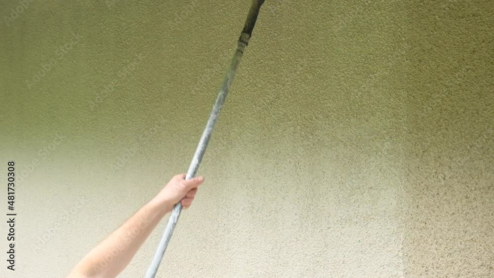 Roller painting the walls in beige color.wall painting.Home renovation ...