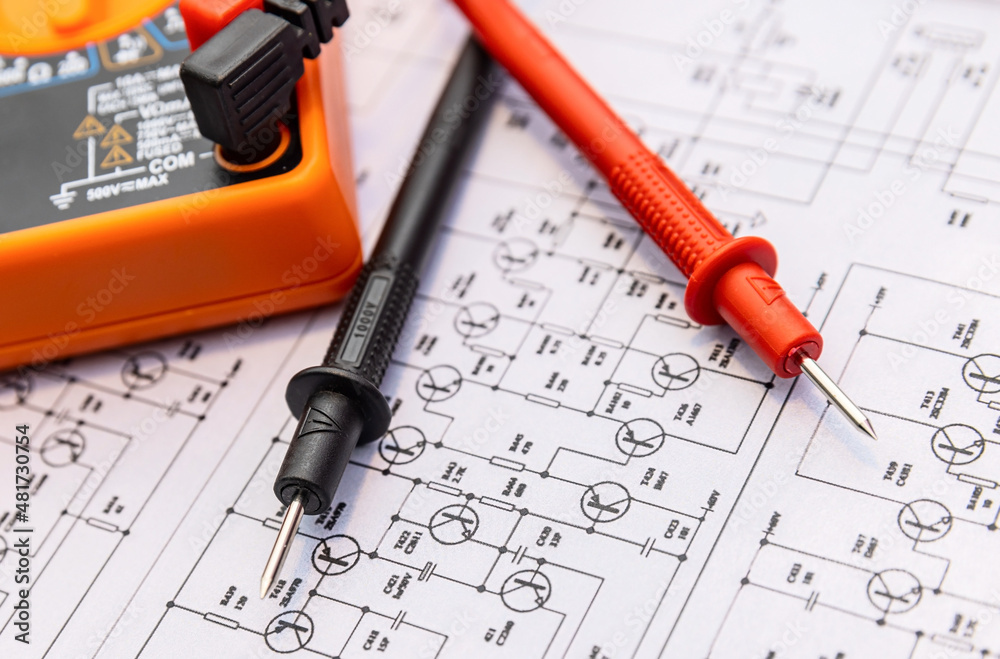 Orange digital electronic multimeter with black and red measurement ...