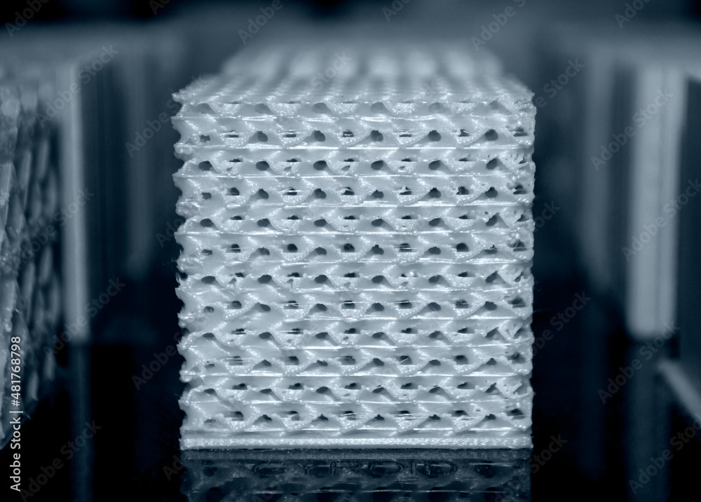 White object 3D printed from plastic close-up. New 3D printing ...