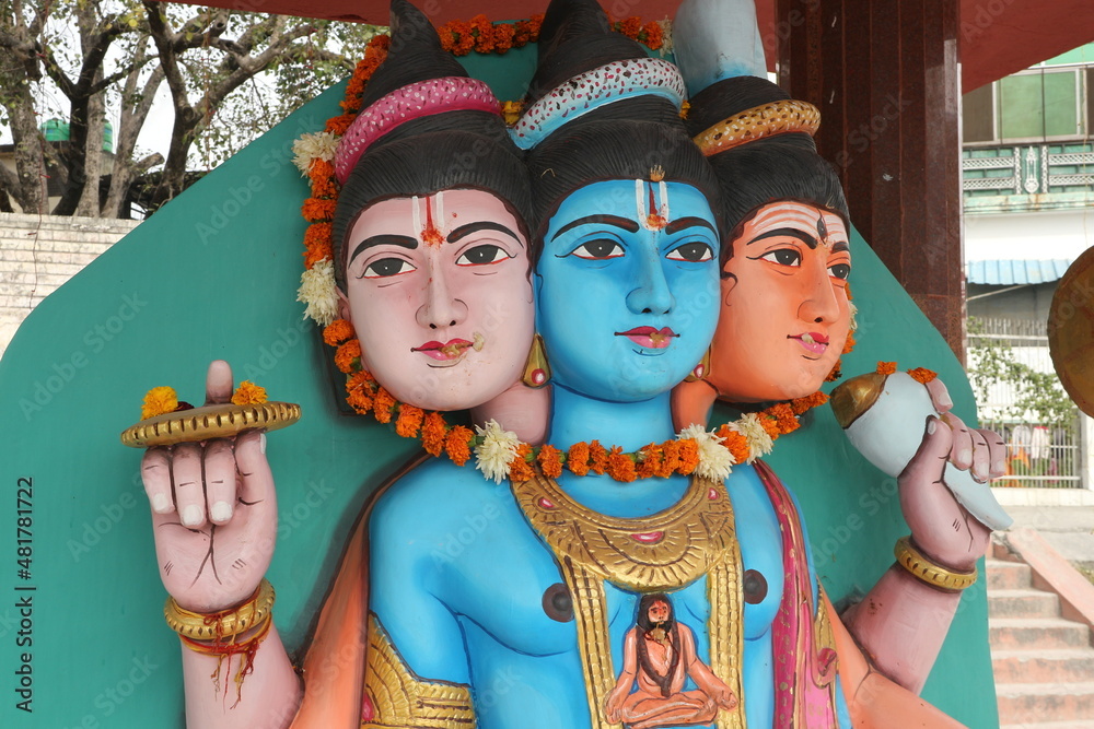 Three-headed Indian god. Hindu temple in Rishikesh. Stock Photo | Adobe ...