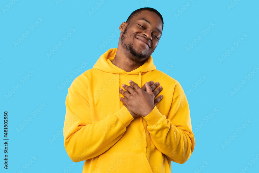 Thankful African Guy Pressing Hands To Chest Over Blue Background Stock ...