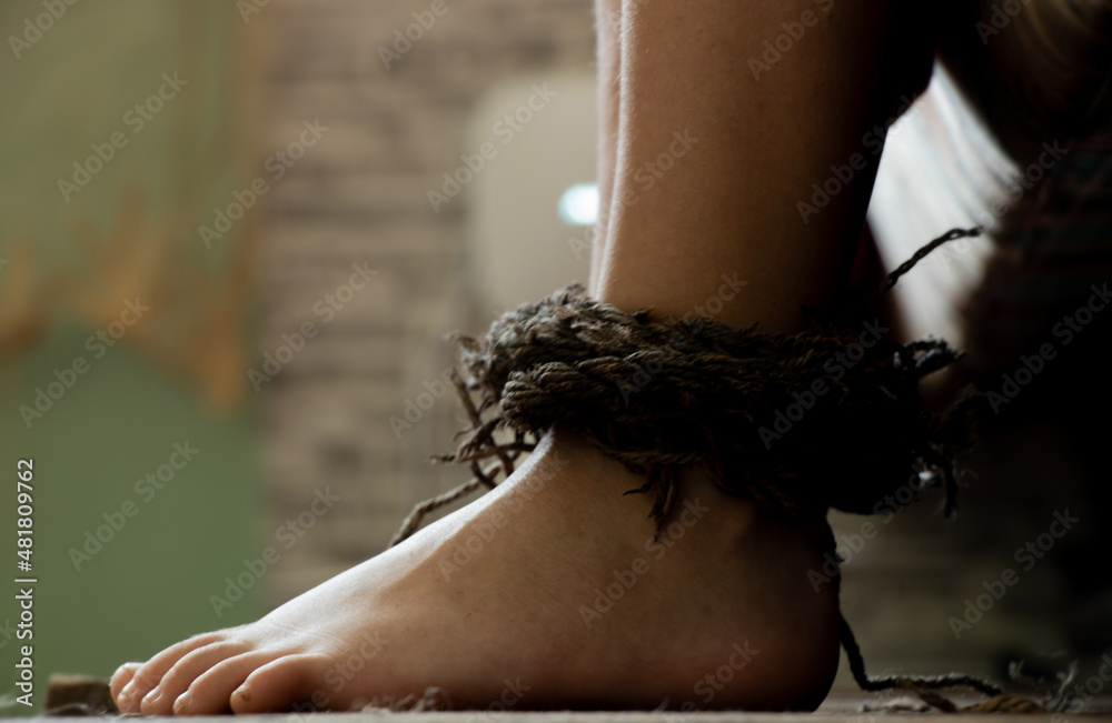 children's feet bound with an old dirty rope, slavery and theft of ...