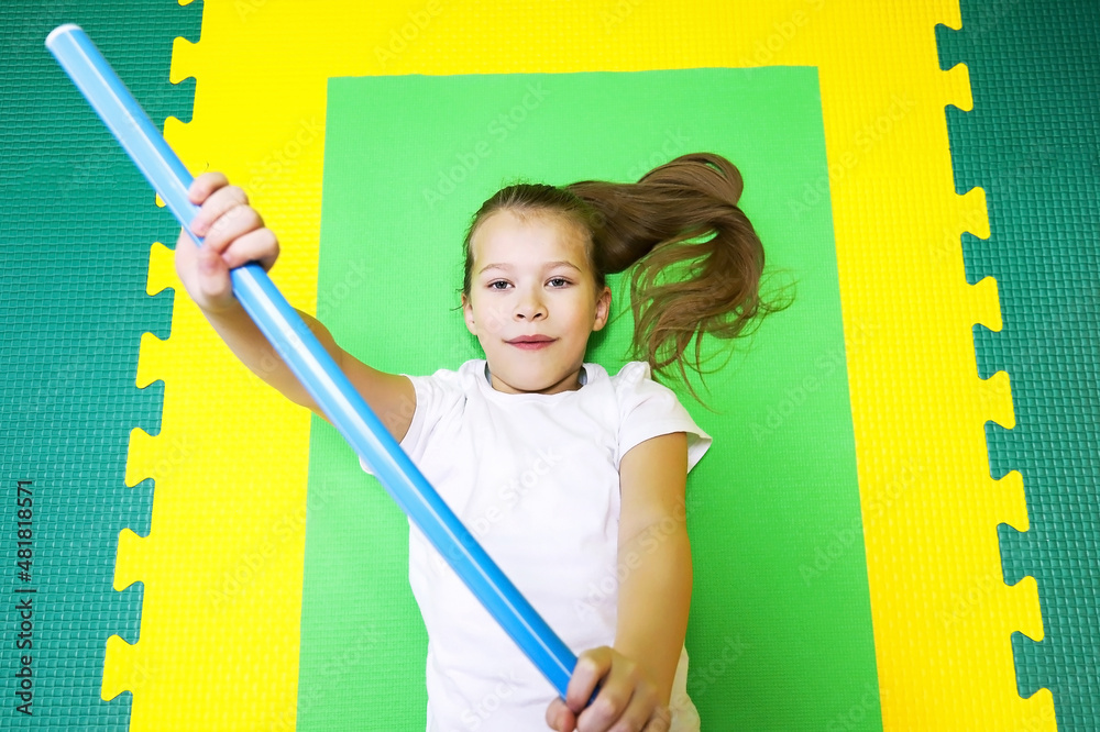 A little girl goes in for sports in a special children's center using a ...