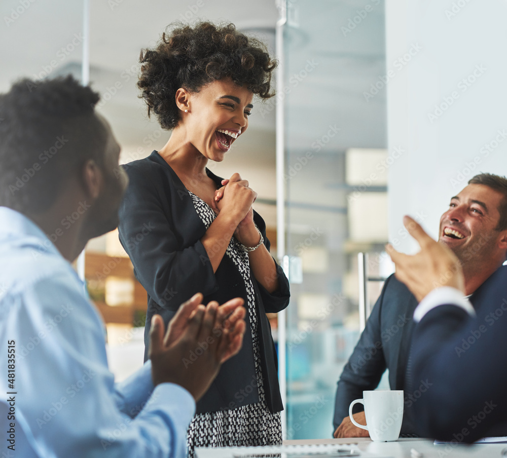 Laugh out loud moments at work. Shot of colleagues laughing together in ...