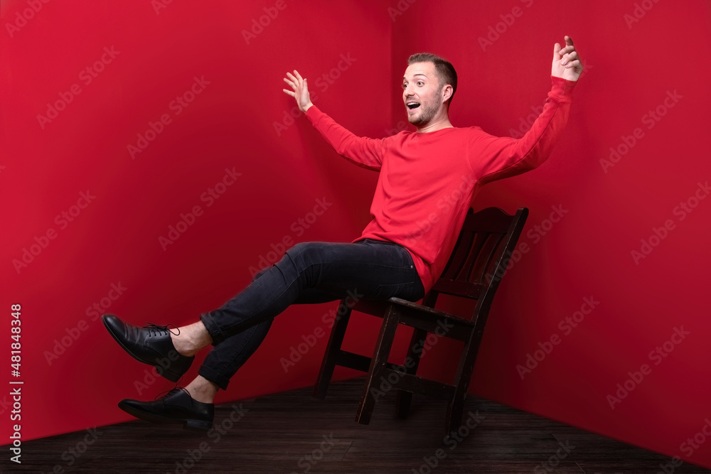 misadventure shows fall from chair with hands wide open looks like he ...