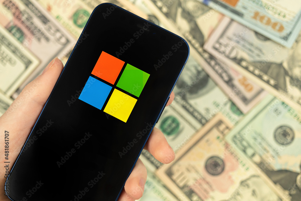 Microsoft logo. Smartphone with company icon. Business background ...