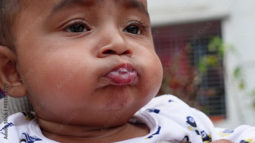 Cutest cheeks baby having fun on the mouth. The cutest toddler's baby ...