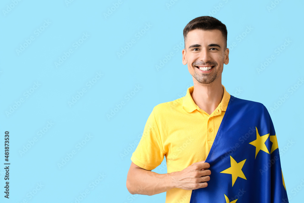Young man with flag of European Union on color background Stock Photo ...