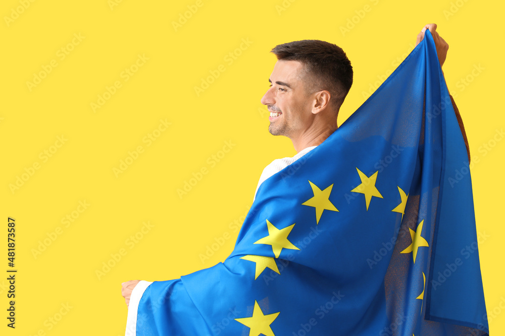 Young man with flag of European Union on color background Stock Photo ...