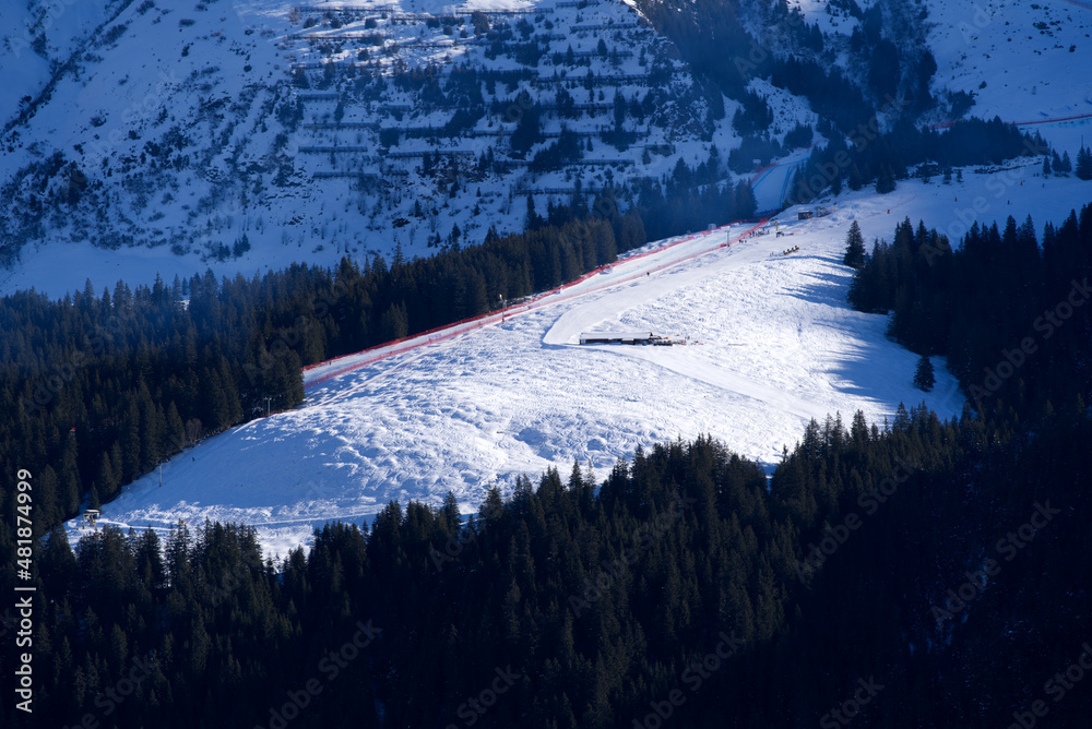 Swiss Alps with downhill slope of famous Lauberhorn Ski Race on a sunny ...