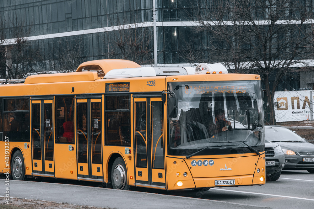 Ukraine, Kyiv - 15 January 2022: Yellow public transport bus car moving ...