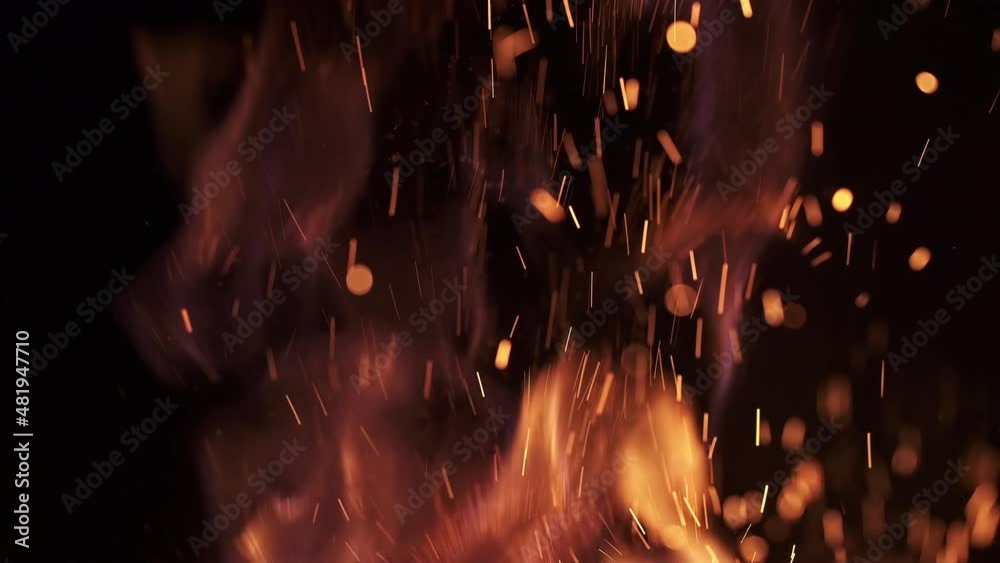 Video „Fire burns down at night. Hot flame and sparks on black ...