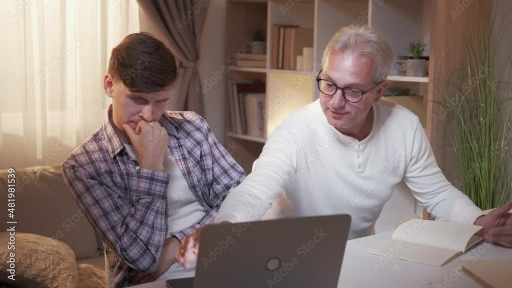 Teaching father. Study together. Parenthood leisure. Supportive ...