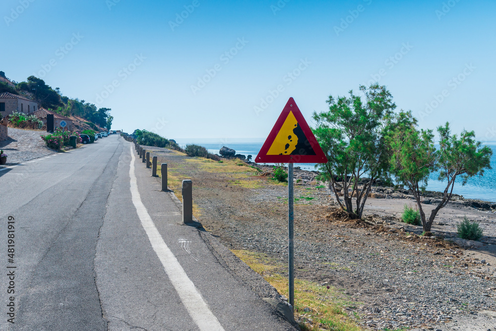 Road sign falling stones. Traffic sign caution possible falling rocks ...