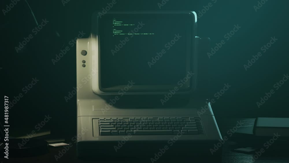 Old personal computer or PC with source code running on screen, display ...