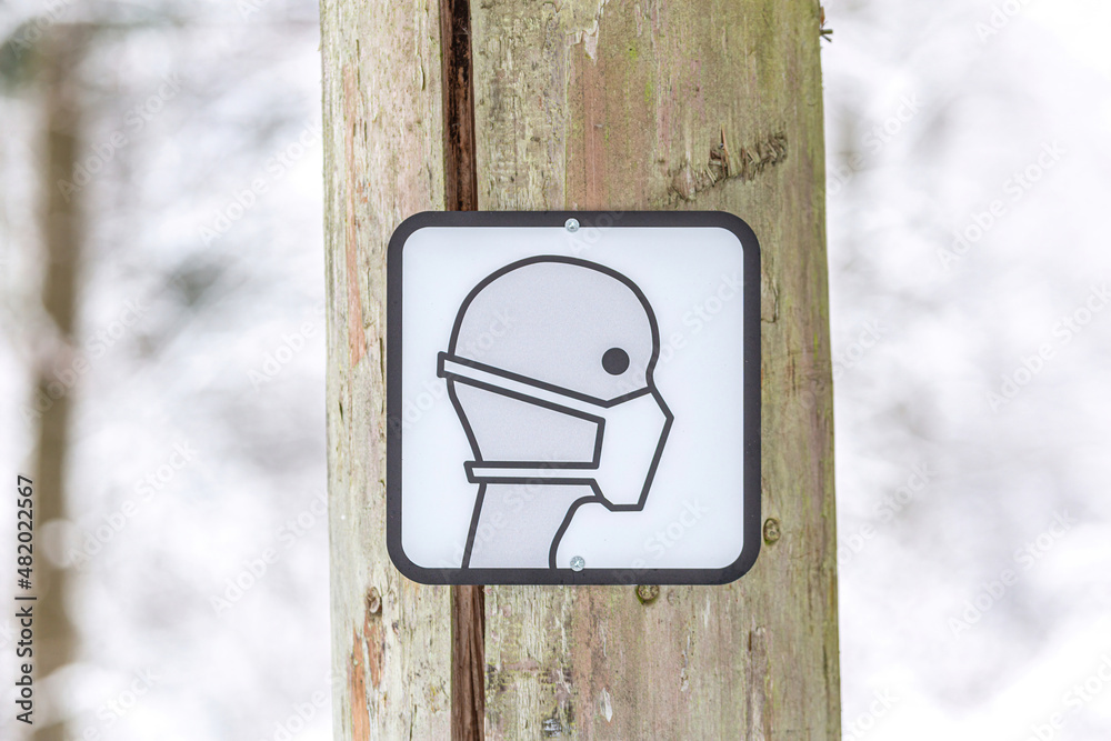 Corona safety signs to mark mask wearing and distance areas Stock Photo ...